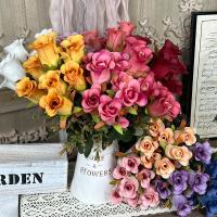 China Simulated 7-head artificial fake silk bouquet with high-end feeling for weddings, decorative flower arrangement in living rooms, plastic roses for sale