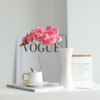 China A fresh and elegant 3D printed 7-head film Phalaenopsis artificial flower, light luxury home living room and dining table floral arrangement artificial flower for sale