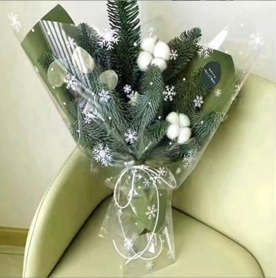 China Christmas waterproof snowflake cellophane flower shop, Christmas Eve flower bouquets, gifts, apple packaging factory wholesale and direct sales for sale