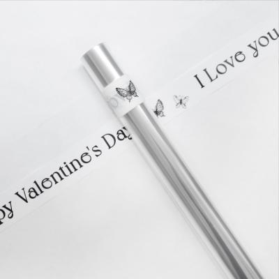 China Romantic Flower Wrapping Paper Transparent OPP Cellophane Roll for DY Packaging 57*1000cm for sale