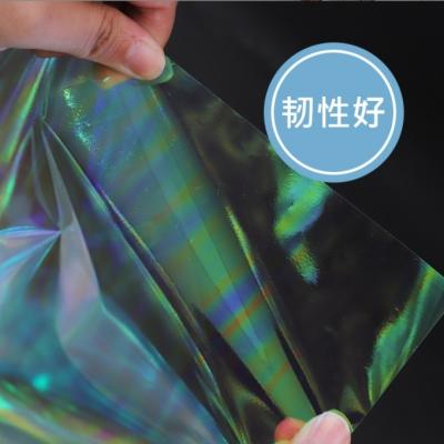 China Wholesale waterproof rainbow film, transparent glass paper, flower paper, laser paper, flower bouquet packaging paper materials for sale