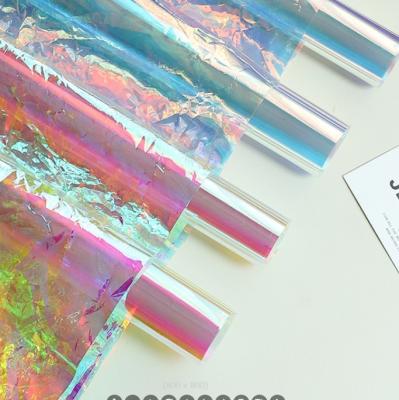 China Colorful film flower wrapping paper, pearlescent paper, laser rainbow, transparent seven-color candy paper, colorful flower wrapping material for sale