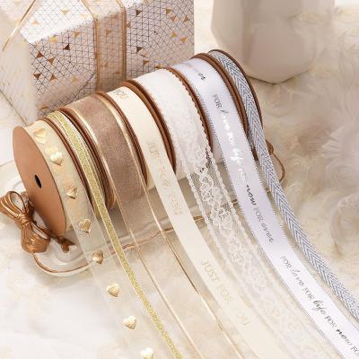 China Christmas Gift Decoration Snow Silk Ribbon 520 in Golden Polyester Gold and Silver Silk for sale