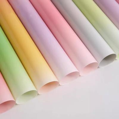 China Flower Wrapping Paper in Many Colors Hansu Paper for Gradient Color Candy Glass Waterproof Plastic Bouquet Packaging Material for sale