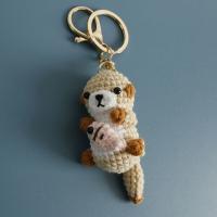 China Knitting Amigurumi Cute Plush Otter Holding Fish Keychain Oyuncak Crochet Animal Toys Doll Soft Crocheted Otter Keychains for sale