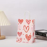 China Red 80gsm Kraft Paper Gift Bags Love Heart Printed Paper Goodie Bags With Handles for sale