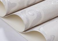 China Creamy White Living Room Wallpaper with Embossed Symmetrical Floral Pattern for sale