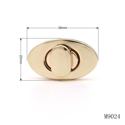 China 38mm Oval Twist Lock Gold Metal Bag Closure for Handbag Hardware for sale
