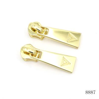 China Custom Engraved Metal Zipper Pulls OEM Gold Plated Zipper Puller for Bags 30 Years Experience for sale