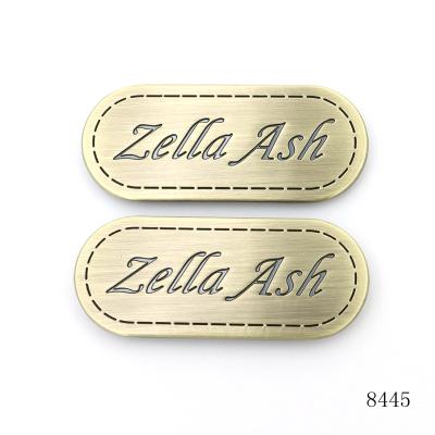 China Custom Die Casting Brass Name Plates Oval Shape Engraved Metal Logo for Handbag 20x30mm for sale