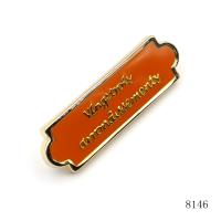 China Gold Plated Zinc Alloy Orange Enamel Metal Tag 40mm x 12mm Custom Logo Plate with Iron Prong Feet for sale