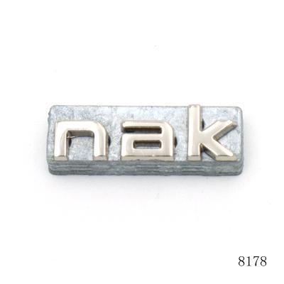 China 23x7mm Custom Zinc Alloy Metal Letter Logo Label for Handbag Purse Hardware Plate for sale
