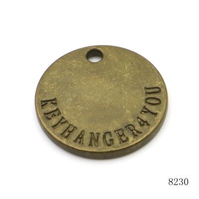 China 23.5mm Round Antique Brass Custom Engraved Metal Tag Logo Charm for Branding for sale