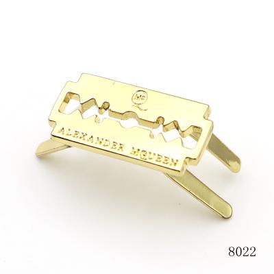 China Gold Plated Custom Hollow Metal Logo Tag 25.6x12.8mm Two Prongs for Handbag Purse for sale
