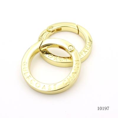 China Custom Logo Engraved Round Spring Clasp Metal Carabiner 25mm for Keychains Handbags for sale