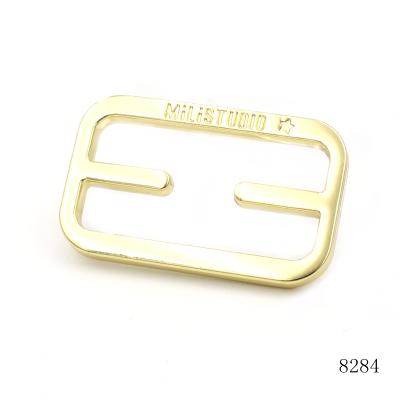 China Gold Polished Branded Metal Strap Slide Buckle 38mm Engraved Logo Adjustable Buckle For Leather Bag And Purse Straps for sale