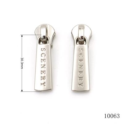 China Nickel Logo Engraved Metal Zipper Puller Customized Shape Size Metal Zipper Puller Label For Handbag for sale