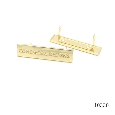 China Custom Zinc Alloy Metal Name Plate Gold Polished Logo Label for Bags 500pcs MOQ for sale