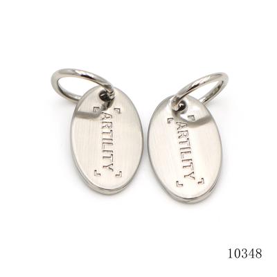 China Custom Zinc Alloy Oval Metal Logo Tag Keychain Charm for Bag Purse 500 pcs MOQ for sale