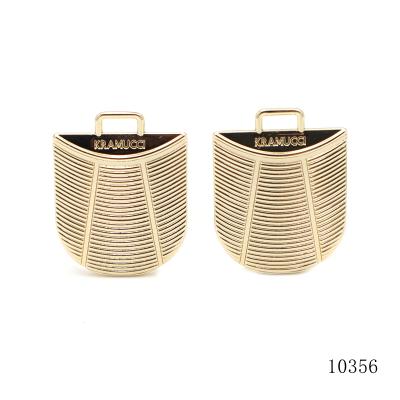 China Custom Shield Shape Zinc Alloy Metal Hanging Emblem Bag Logo Tag 35x27mm for sale