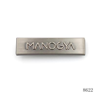 China 38mm Brushed Gunmetal Rectangle Bag Metal Label Plate Custom Metal Embossed Logo Name Plate for sale