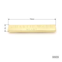 China Custom embossed zinc alloy metal logo plate gold rectangular bag name label with back prongs for leather handbag hardware for sale