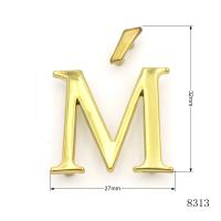 China Golden Custom Metal M Letter Custom Shape Metal Logo Zinc Alloy Brand Logo Label  For Clothing for sale
