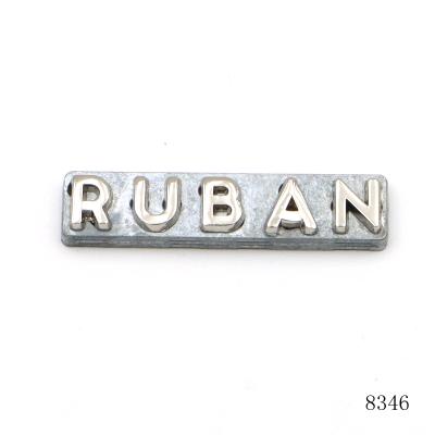 China Custom Metal Letter Logo Plate 36x6.7mm Eco Friendly Zinc Alloy for Bag Purse for sale