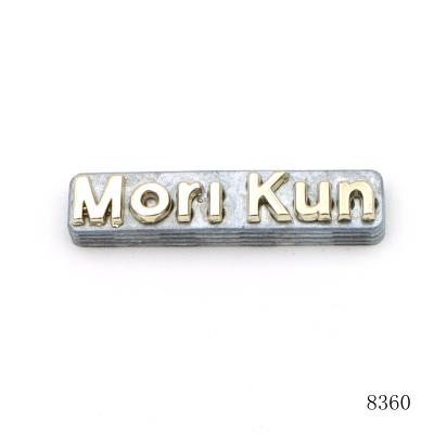 China Custom Metal Letter Logo Plate 35x6.3mm Zinc Alloy Handbag Hardware Gold Electroplated for sale