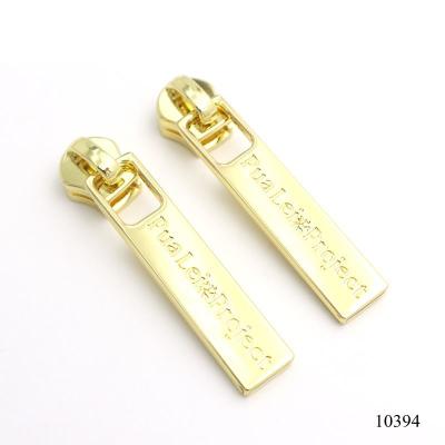 China Custom Embossed Logo Metal Zipper Pulls, Gold Plated Bag Zipper Tags for sale