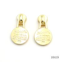 China Custom Engraved Round Metal Zipper Pull Gold Plated Handbag Zipper Charm for sale