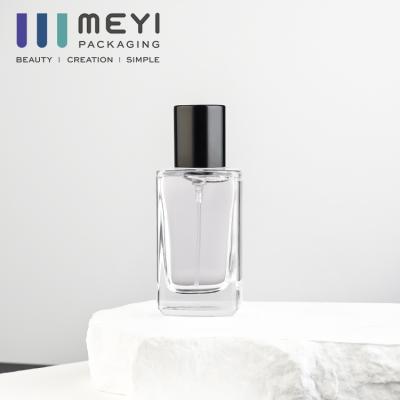 China 30ml Square Clear Glass Perfume Bottle with Black Cap and Pump Sprayer for sale