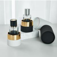 China 50ml Round Luxury Glass Perfume Bottle with Magnetic Cap and Black Soft-touching Paper Tube Box for sale