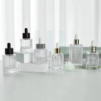 China Essential Oil Glass Dropper Bottles Round Amber Clear Frosted Glass Bottles Suitable for Cosmetic Chemical and Perfume for sale