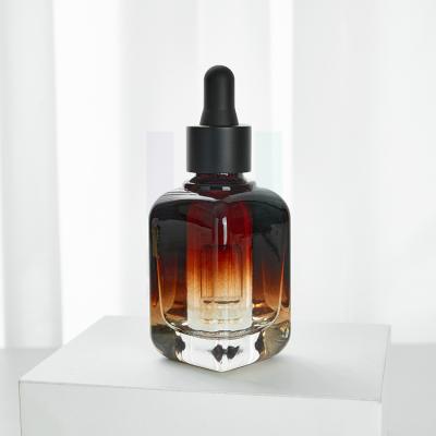 China Screw Cap Glass Dropper Bottles Round Design Featuring Screen Printing Hot Stamping and Labeling for Liquid Product Containers for sale