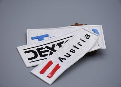 China Woven Fabric Printed Matte Silicone Logo Patch White For Garments for sale