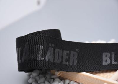 China Garment Custom Logo Polyester Webbing Straps Embossed 35mm Black for sale