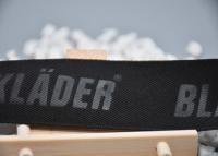 China Garment Custom Logo Polyester Webbing Straps Embossed 35mm Black for sale