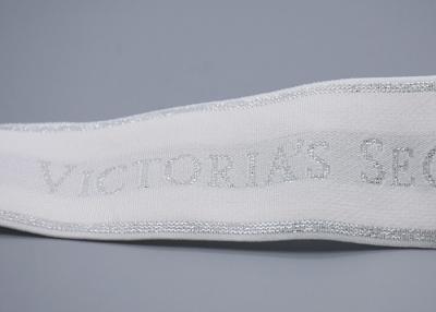 China Custom 35mm White Jacquard Elastic Tape with Shiny Silver Logo for Garments for sale