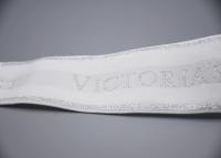 China Custom 35mm White Jacquard Elastic Tape with Shiny Silver Logo for Garments for sale