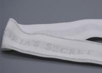 China Custom 35mm White Jacquard Elastic Tape with Shiny Silver Logo for Garments for sale