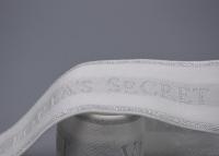 China Custom 35mm White Jacquard Elastic Tape with Shiny Silver Logo for Garments for sale