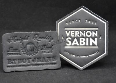 China Small Black Custom Leather Clothing Labels - 500pcs MOQ with Hot Stamped White Infill for Jeans Waistbands for sale