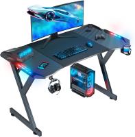 China Gaming Desk With Ergonomic Design Carbon Fiber Finish LED Lights Convenient Accessories For Living Spaces Or Gamers for sale
