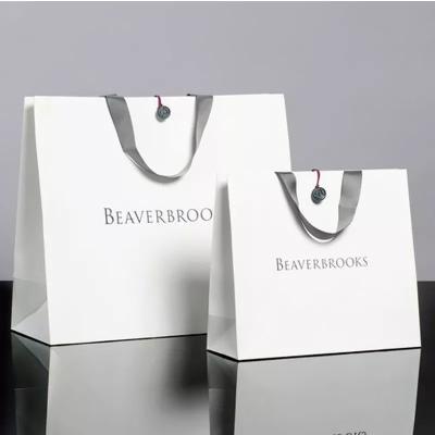 China Foldable White Kraft Paper Carrier Bags 44x13x32cm Custom Logo Eco-Friendly for sale