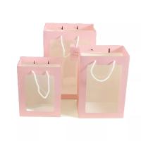 China Handmade Offset Printing Kraft Paper Gift Bags With Clear Window for sale