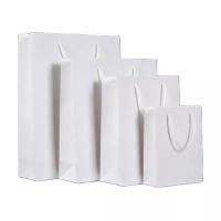 China Custom Printed Kraft Paper Gift Bags with Handles 350gsm Grocery Carrier Bags for sale