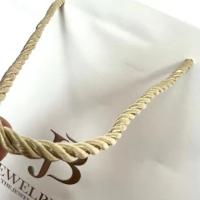 China Washable Foldable Kraft Paper Carrier Bags 25x8x20cm 40x11x30cm Custom Logo for sale