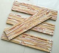China Yellow Wooden Sandstone Mini Culture Stone 600x150mm Waterfall Shape Ledgestone for sale