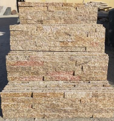 China Tiger Skin Yellow Granite Ledgestone Natural Stacked Stone Veneer 600x150x15-25mm Wall Cladding for sale